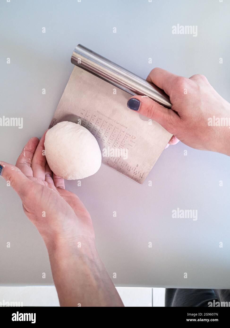 Baker forms a loaf of bread from raw dough Stock Photo - Alamy