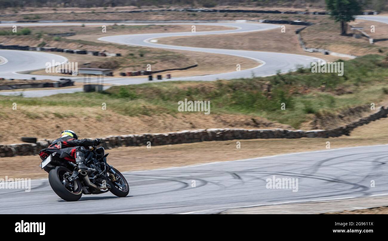man practising laps on race track with his motorcycle Stock Photo - Alamy