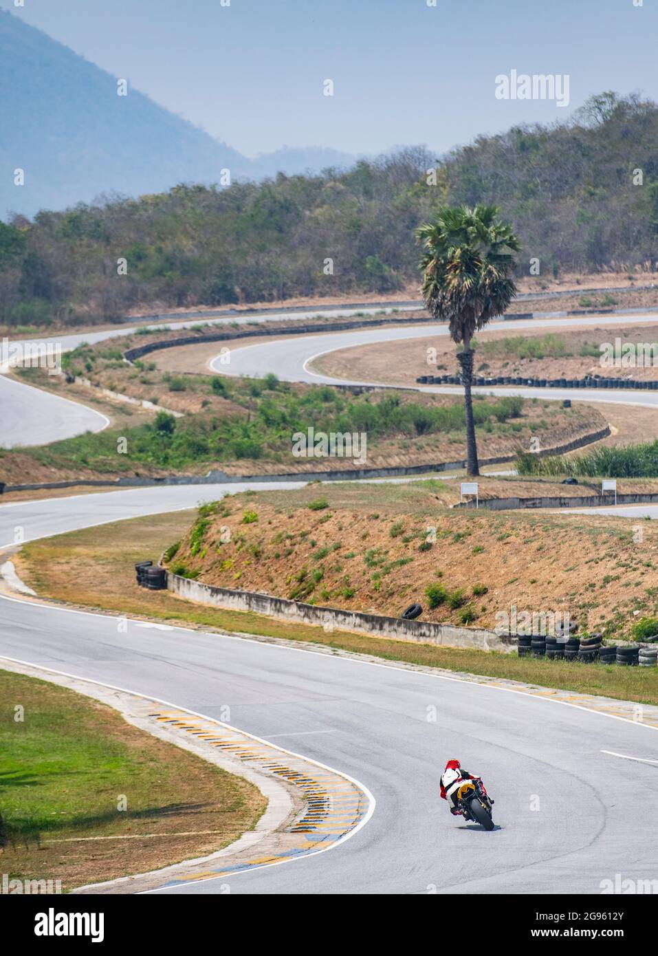 man practising laps on race track with his motorcycle Stock Photo - Alamy