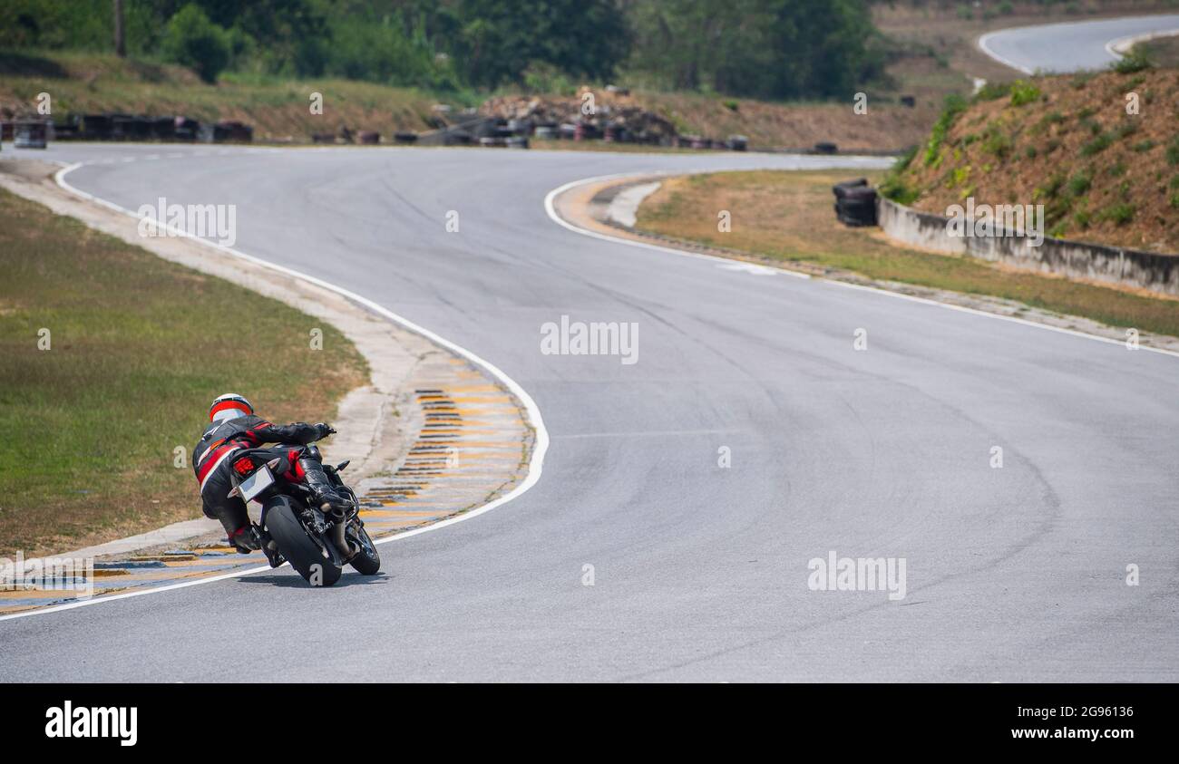 man practising laps on race track with his motorcycle Stock Photo - Alamy