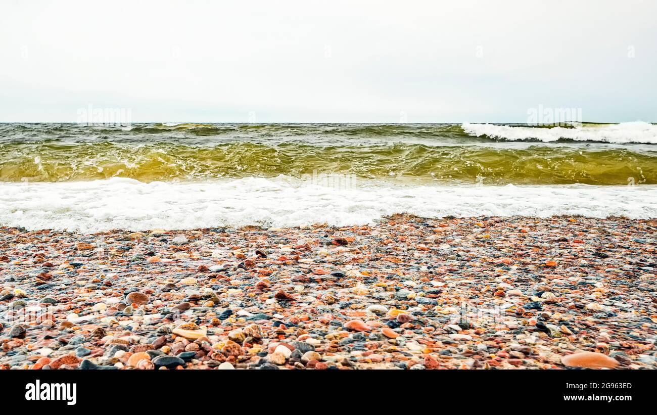 A lot of varieties of sea rocks on a beach against the background of a ...