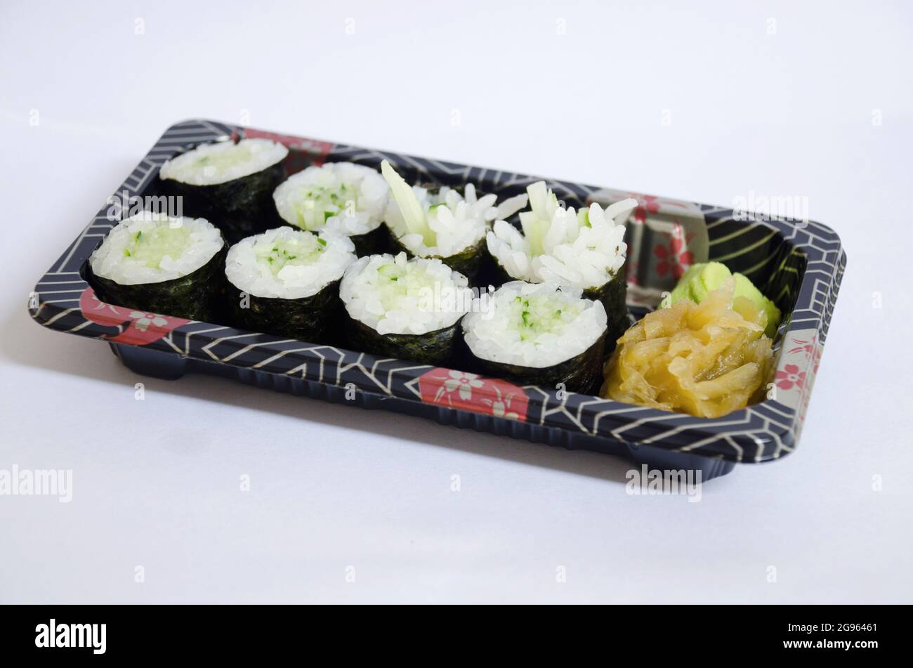 Kappa Maki (Cucumber Sushi Roll) arranged on a tray against a white ...
