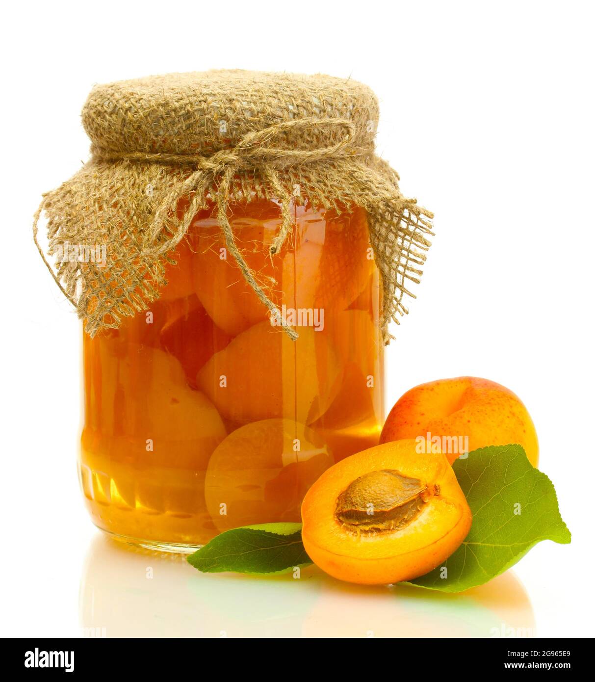 canned apricots in a jar and sweet apricots isolated on white Stock ...