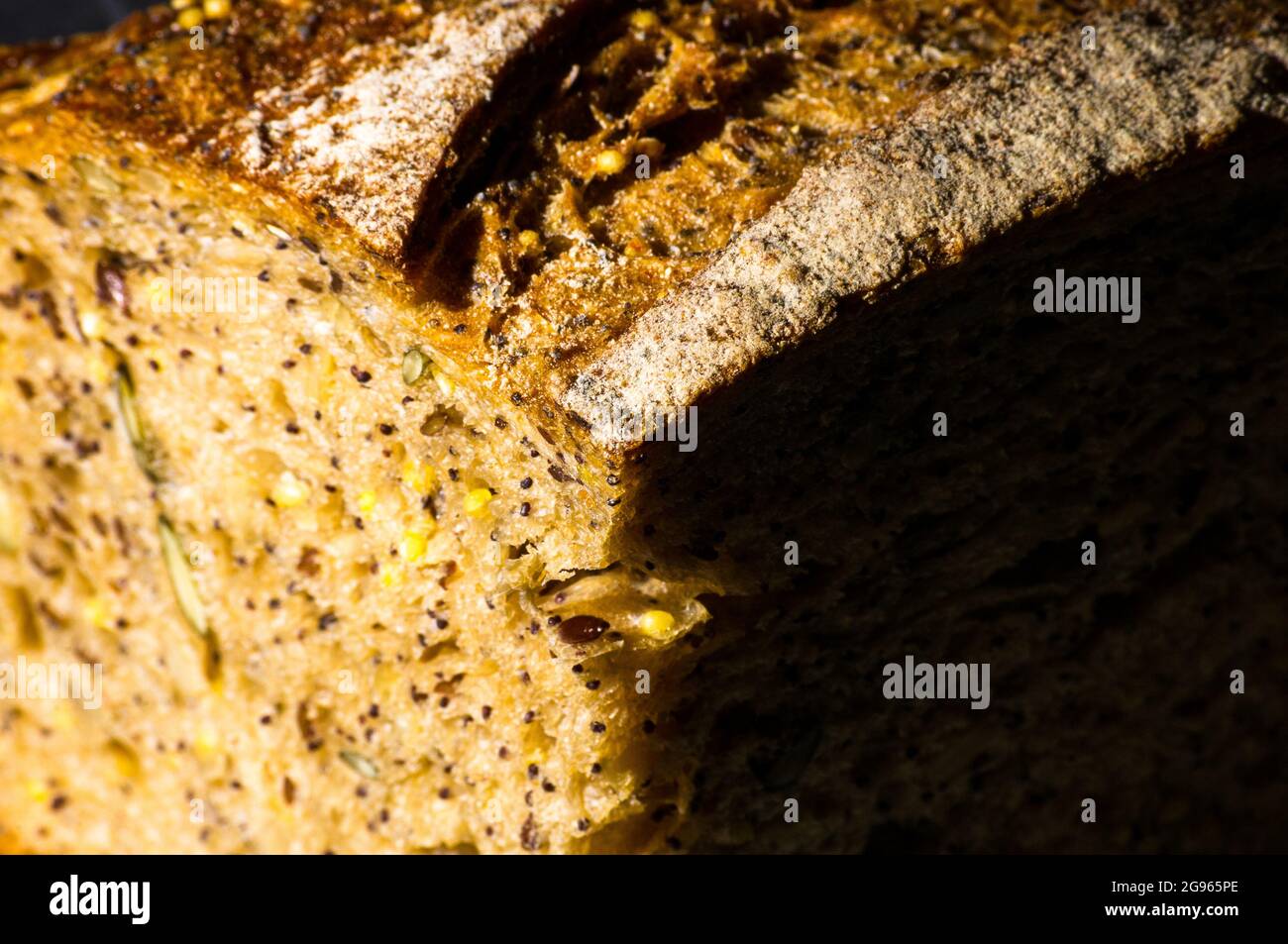 Slice of rustic natural yeast-free bread with flax, poppy seeds, sesame ...