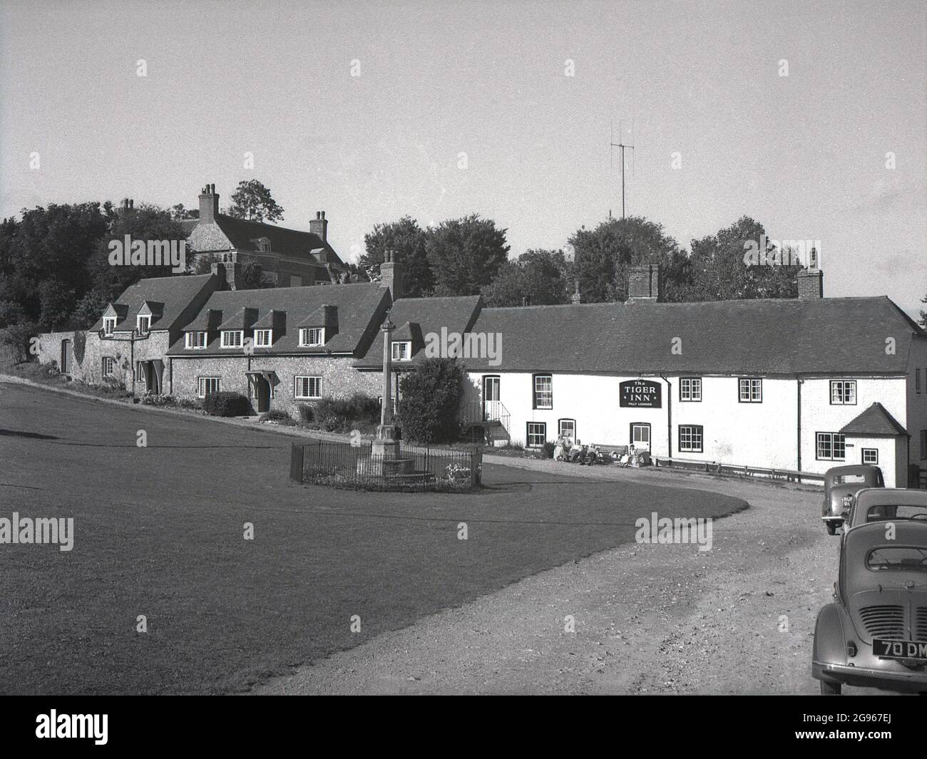 1950s, historical view of the village green, stone memorial and public ...