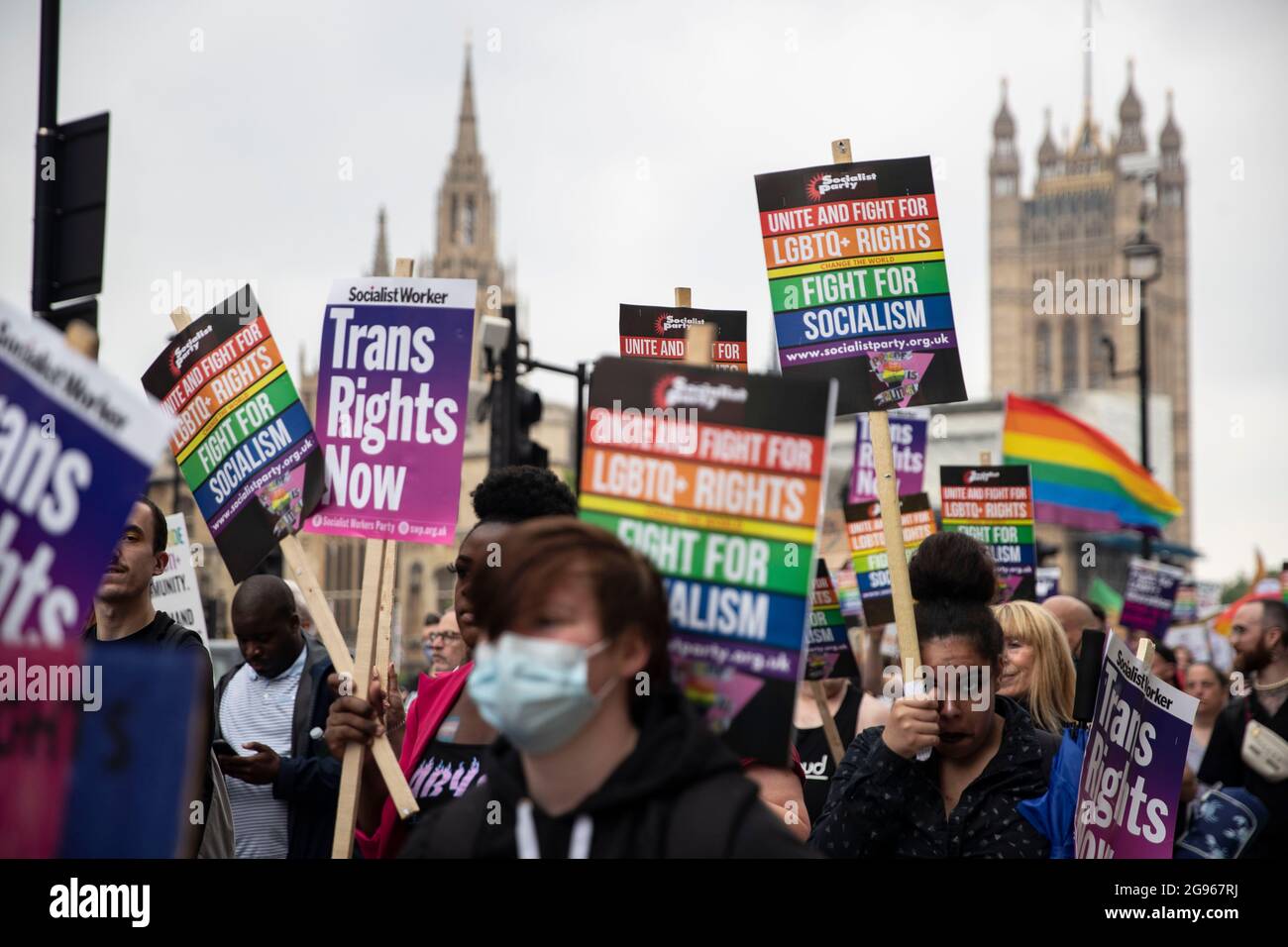 London, UK. 24th July, 2021. LGBT activists holds placards while ...