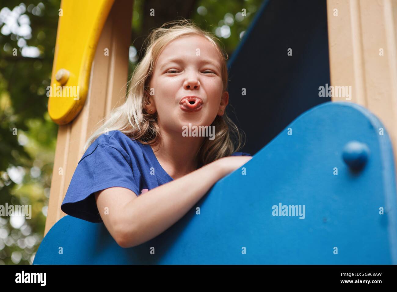 Children playing playground faces hi-res stock photography and images ...