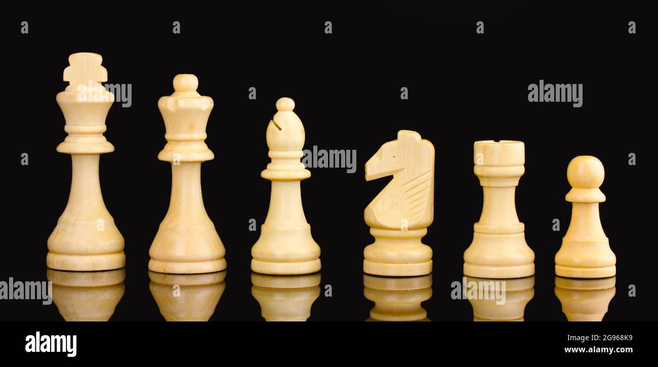 Chess pieces isolated on black Stock Photo - Alamy