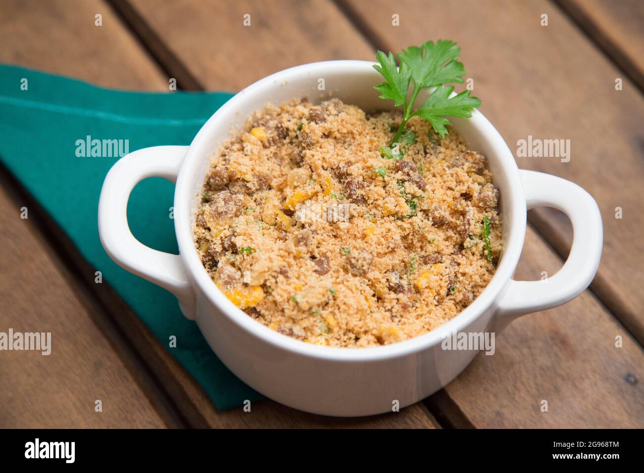 Bowl of farofa. A type of meal made from toasted cassava flour typical ...