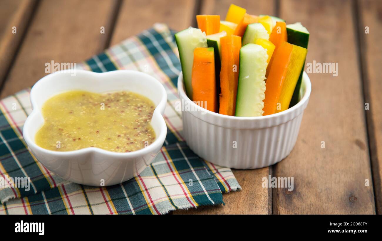 Pinzimonio. Carrot and cucumber snacks with dipping sauce Stock Photo ...