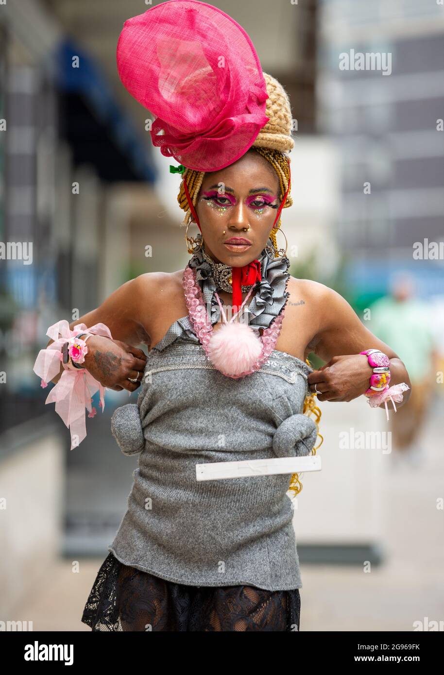 A model showcases Pierre Garroudi's latest colourful collection at one ...