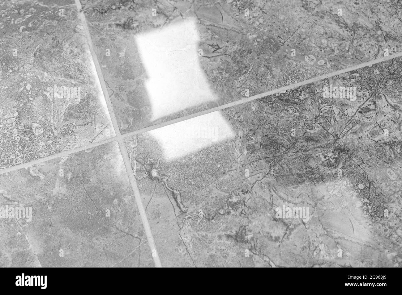 Ceramic floor tile seam close-up, silver ceramic pile with marble ...