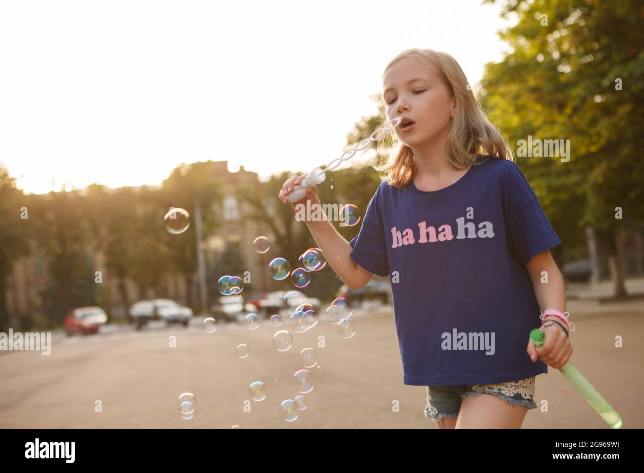 Lovely Young Girl Blowing Bubbles Outdoors In The City Copy Space Lovely Young Girl Blowing Bubbles Outdoors In The City Copy Space