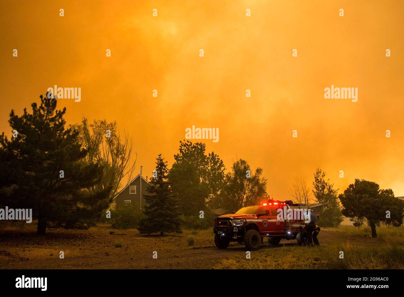 Fire crews work to contain the Tamarack fire as it encroaches on homes ...