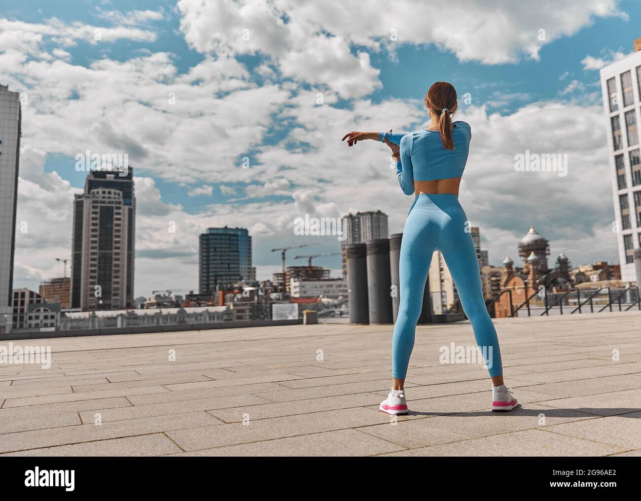 Beautiful fit young woman jogger is running outdoors Stock Photo - Alamy