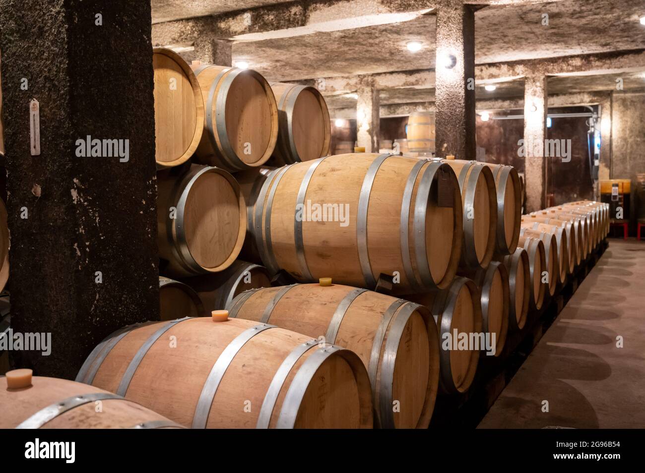 Keeping for years of dry red wine in new oak barrels in caves in ...