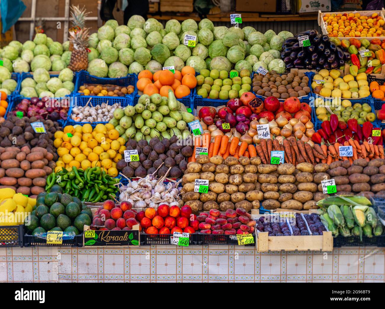 Fresh fruits and vegetables on display at the Sennoy outdoor market ...