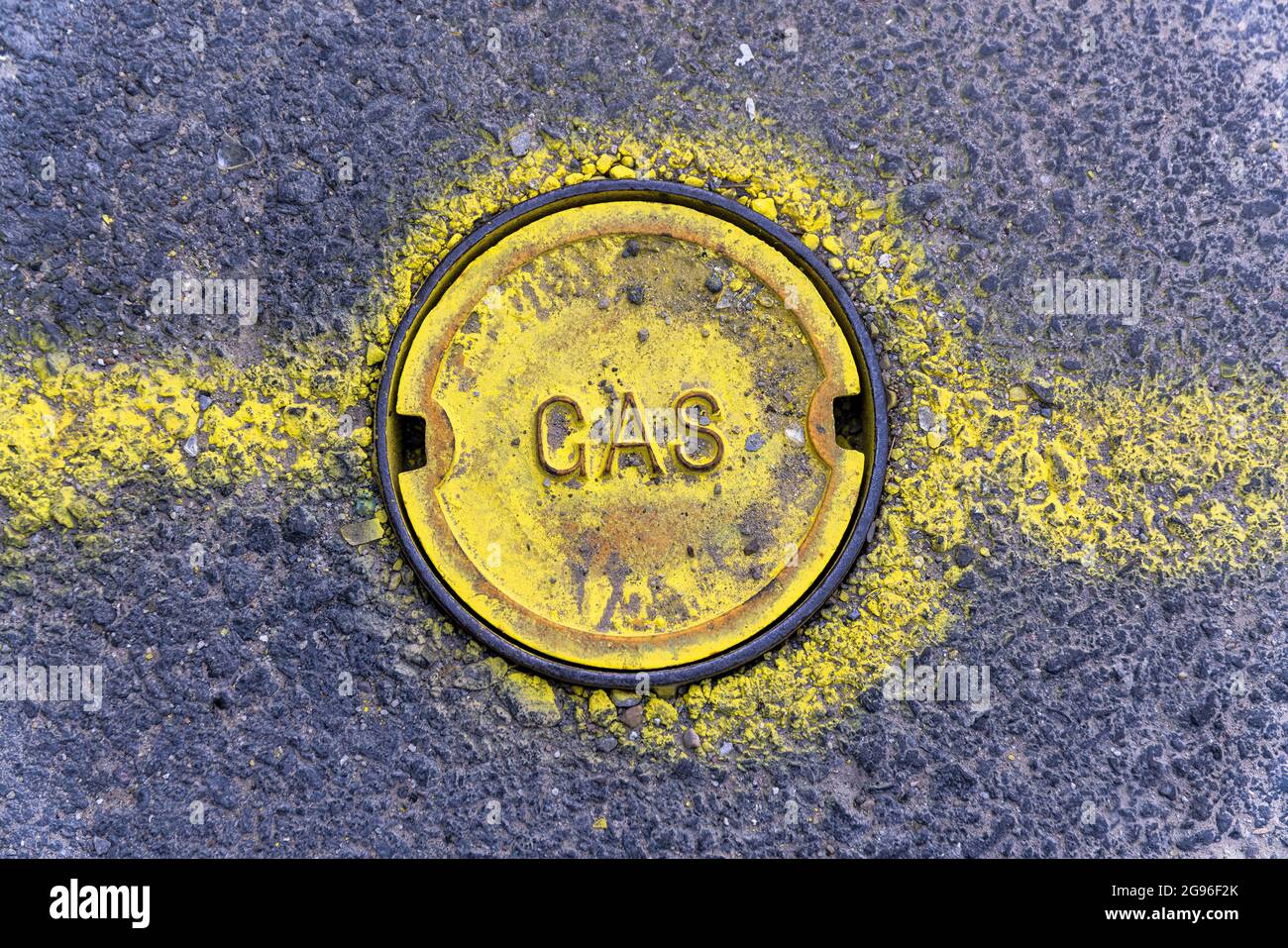Yellow painted gas manhole on the street Stock Photo - Alamy
