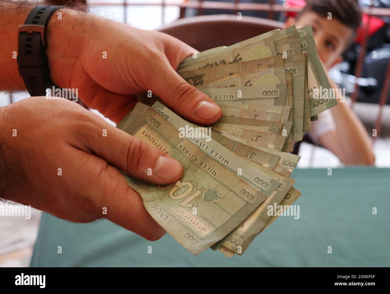 A bundle of 1000 Lebanese pounds banknotes seen in Tripoli, Lebanon, on ...