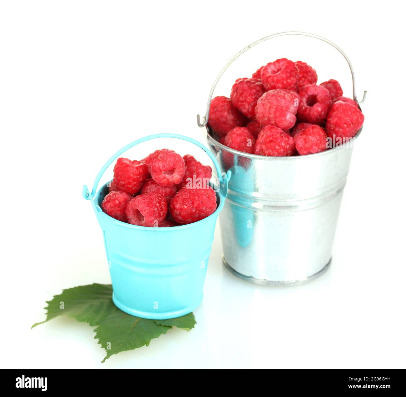 Fresh raspberries in buckets isolated on white Stock Photo - Alamy