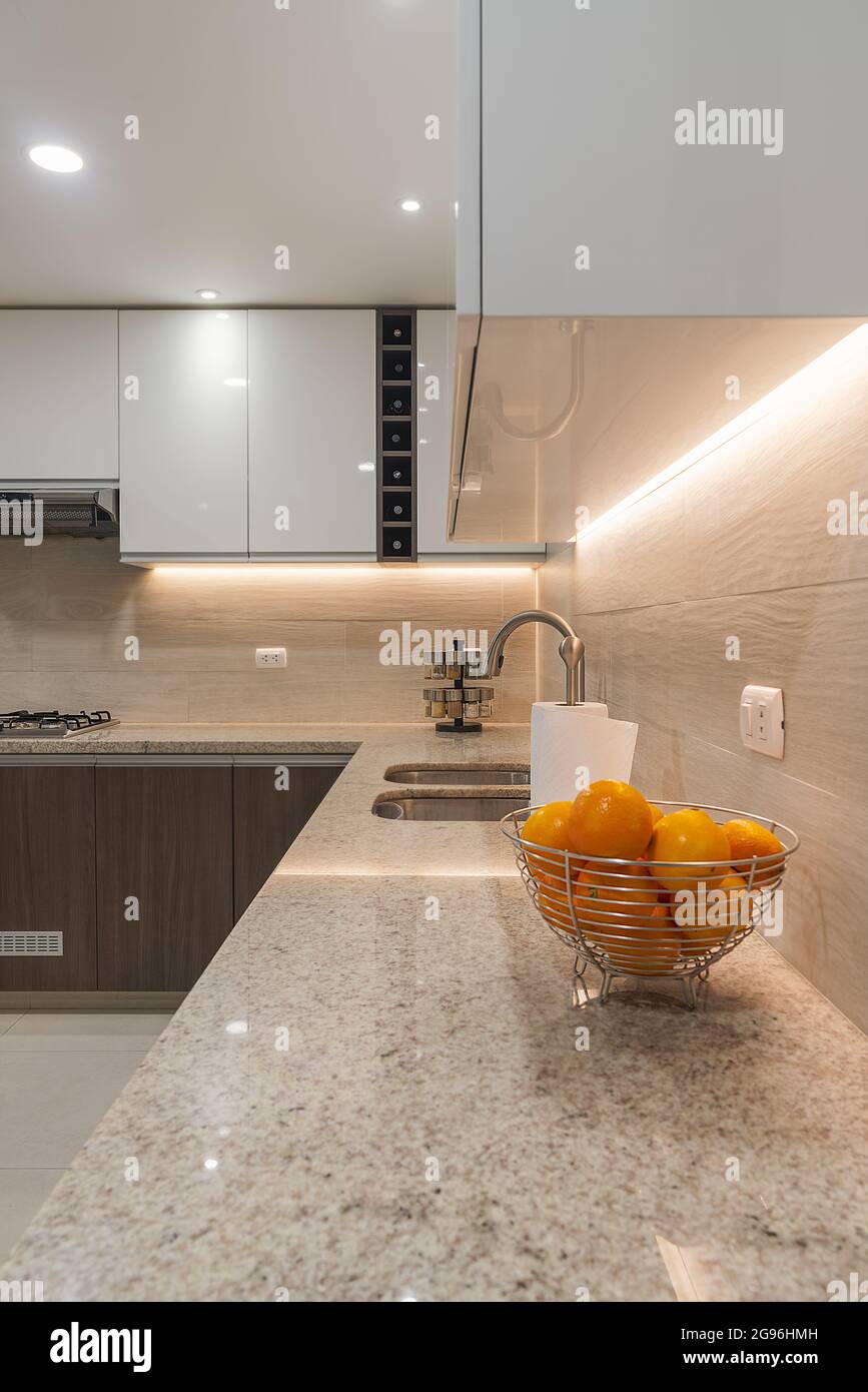 Sink with mixer tap recessed into the granite work surface Stock Photo ...