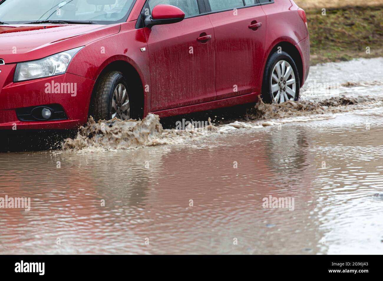 Car stuck in the mud, car wheel in dirty puddle, rough terrain Stock ...