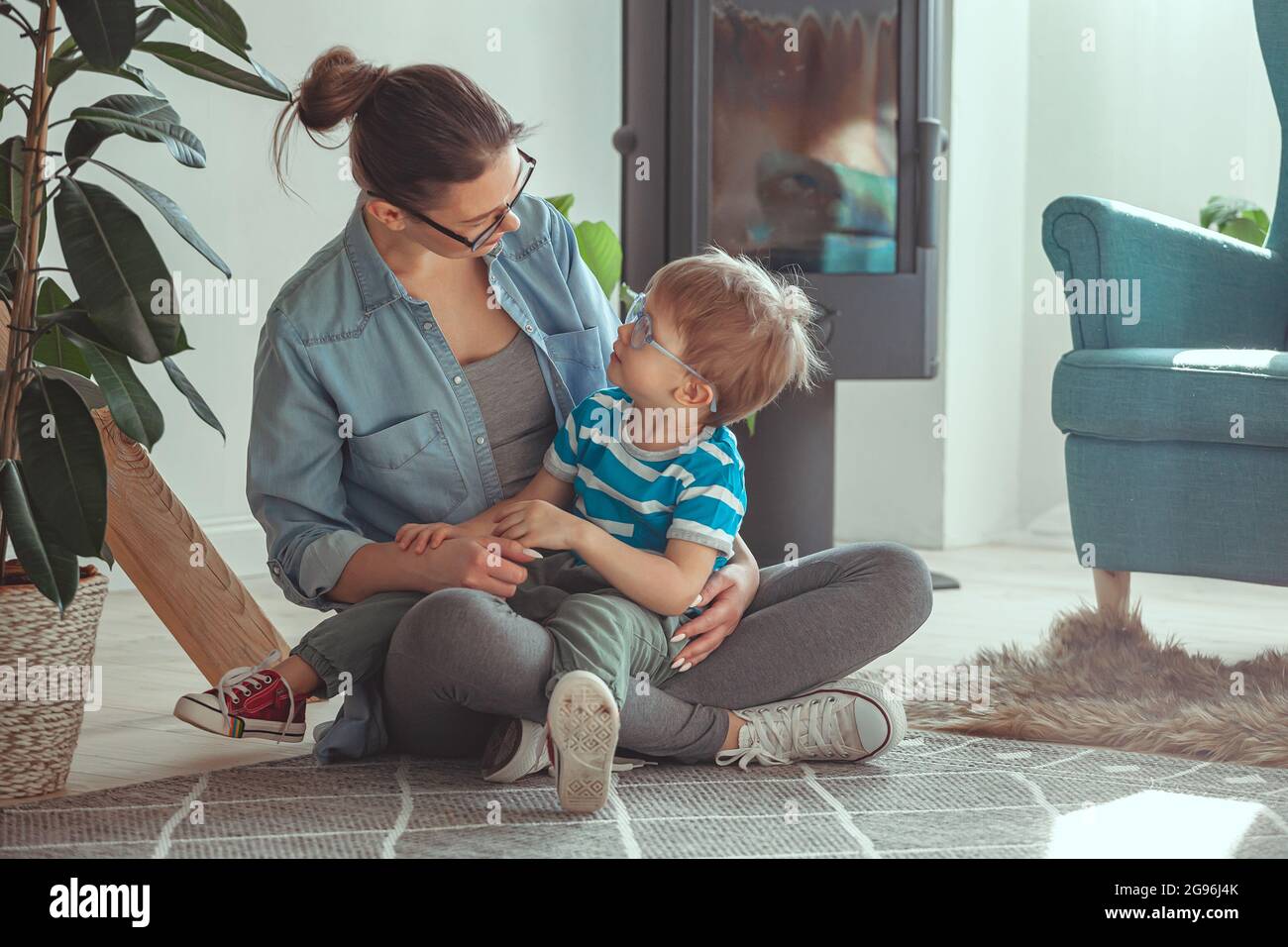 Child hugging adult hi-res stock photography and images - Alamy