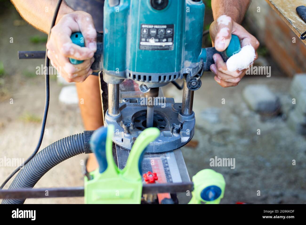 A carpenter works with a wood milling machine. Professional tools for ...