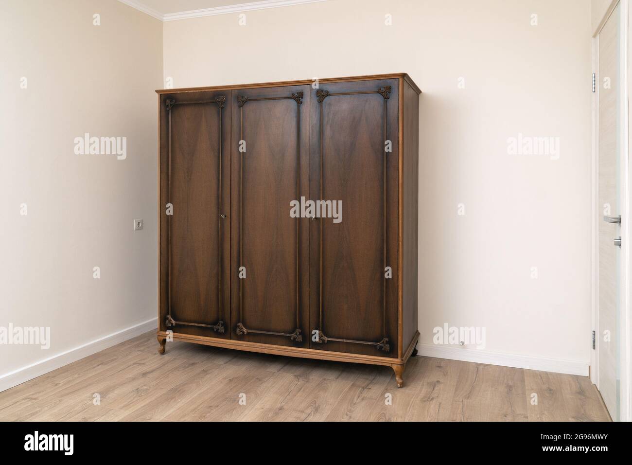 Old wooden wardrobe in a renovated living room Stock Photo - Alamy