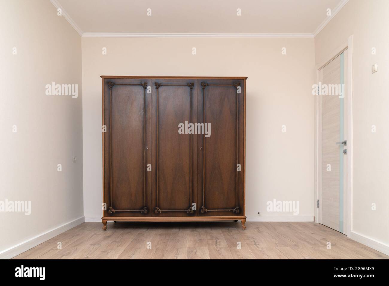Old wooden wardrobe in a renovated living room Stock Photo - Alamy
