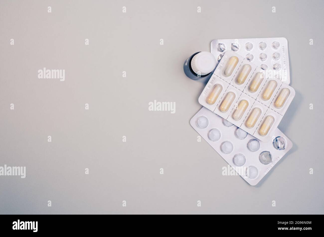 Top view of medicine bottle and tablets isolated on white background ...