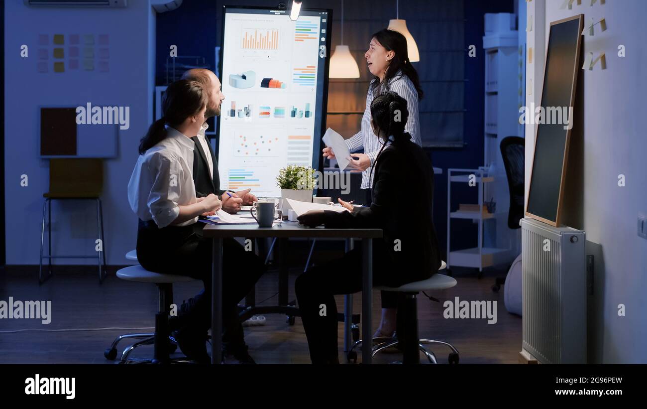 Nervously furious entrepreneur woman screaming while working in meeting ...