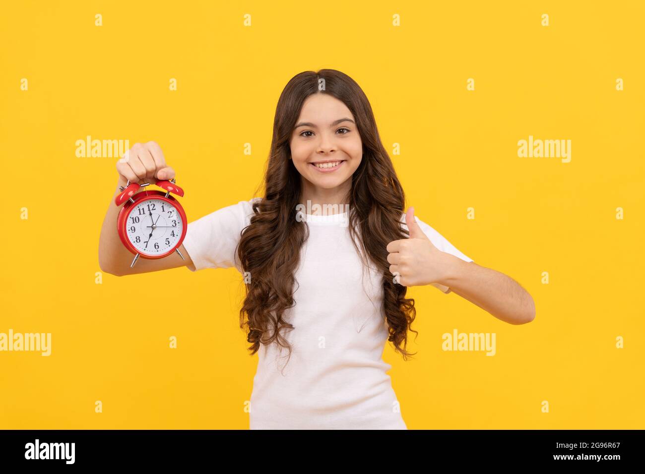 punctual kid with clock. deadline. thumb up. happy child hold alarm ...