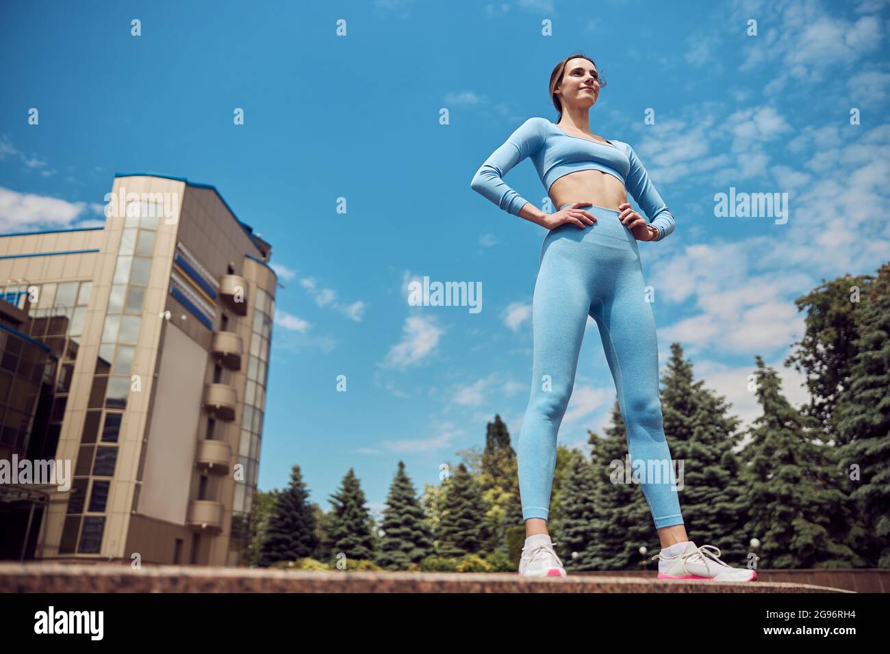 Beautiful fit young woman jogger is running outdoors Stock Photo - Alamy