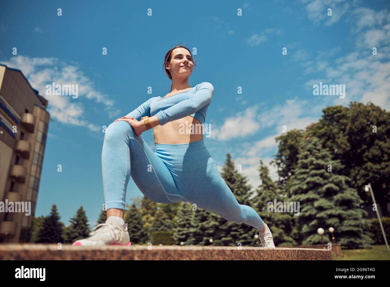 Beautiful fit young woman jogger is running outdoors Stock Photo - Alamy