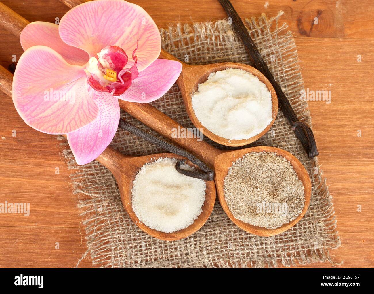Vanilla pods with vanilla and vanilla sugar in wooden spoons on wooden background close-up Stock ...