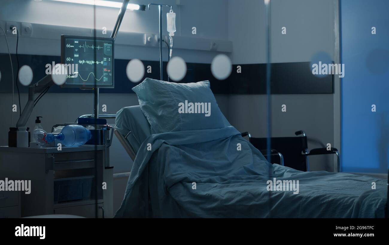 Hospital ward with empty bed at clinical facility for health problems ...