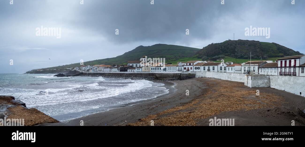 The black sand beach Praia de São Mateus, in Vila da Praia, with the ...