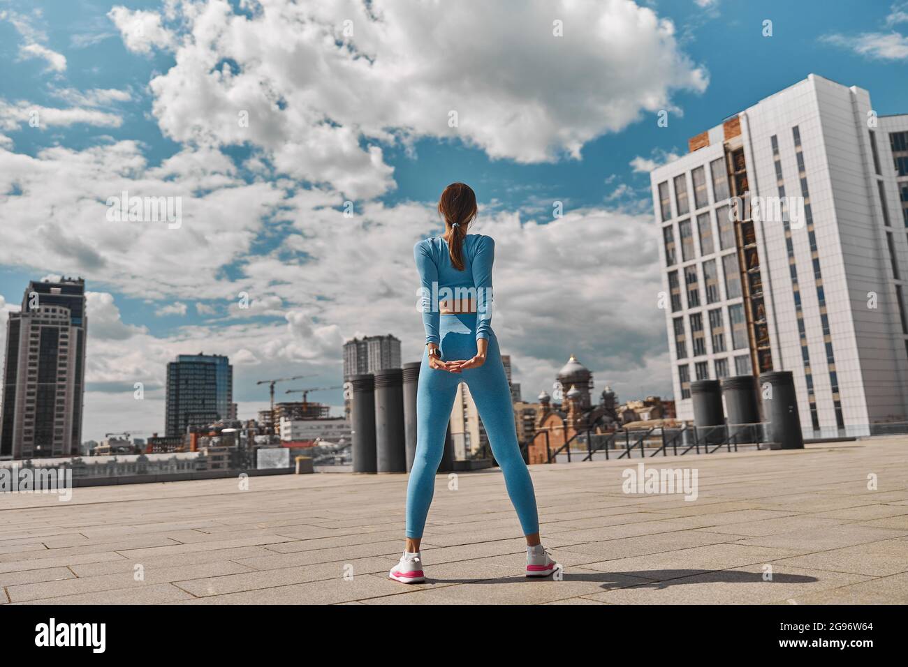 Beautiful fit young woman jogger is running outdoors Stock Photo - Alamy