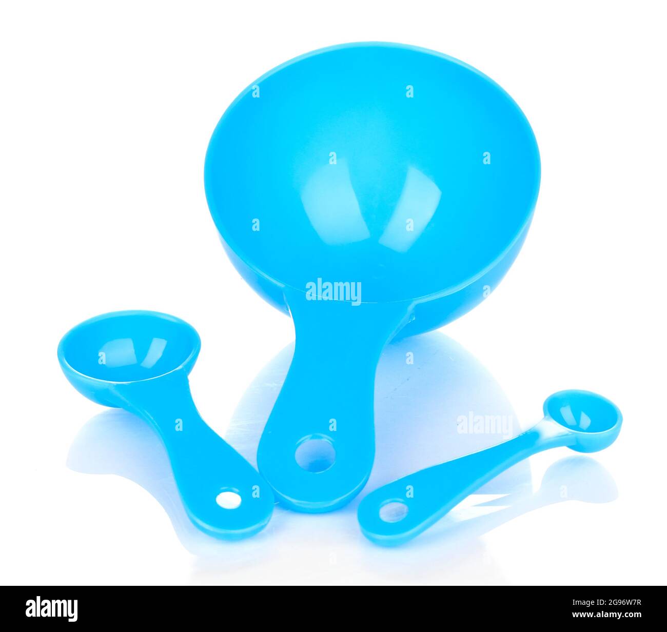 Blue measuring spoons isolated on white Stock Photo - Alamy