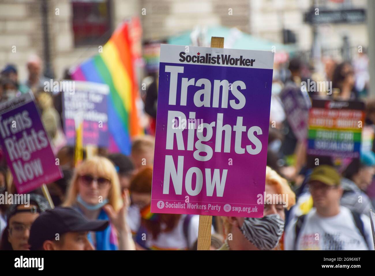 London, UK. 24th July, 2021. A demonstrator holds a placard that says ...