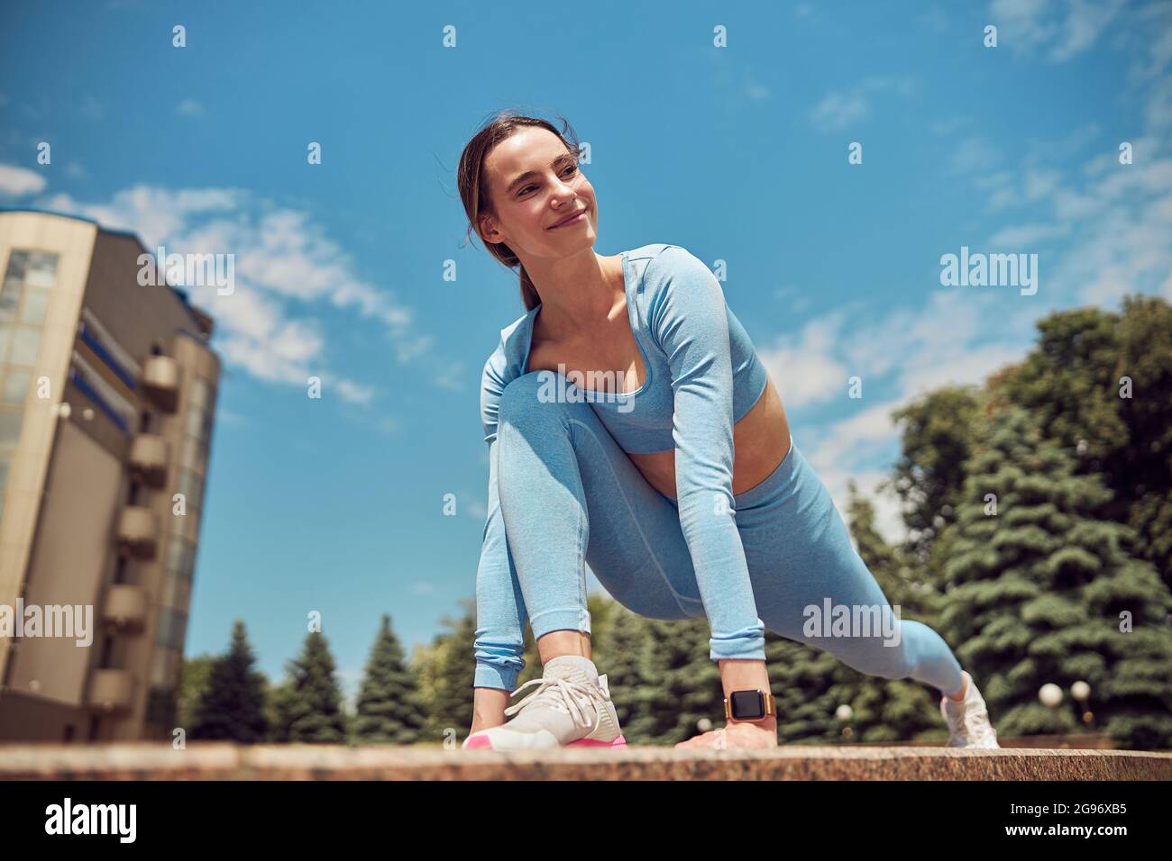 Beautiful fit young woman jogger is running outdoors Stock Photo - Alamy