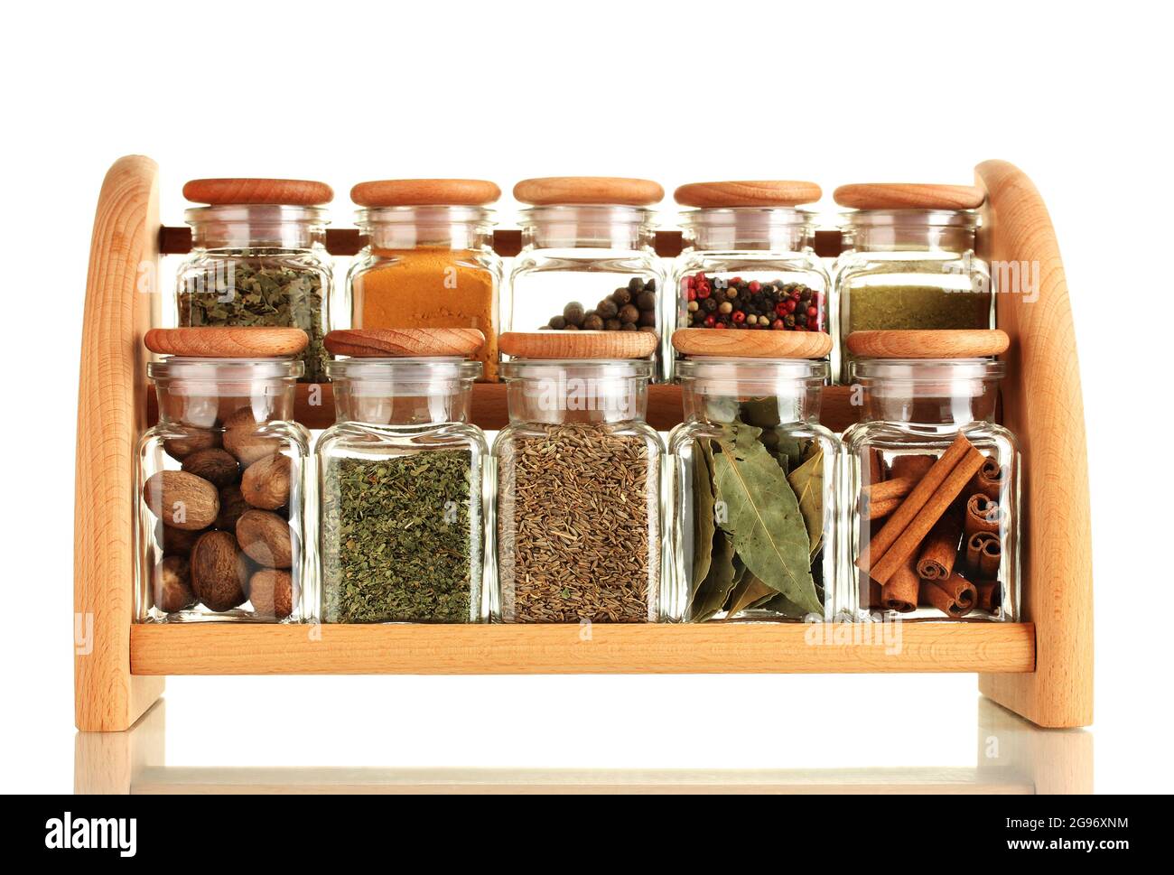 powder spices in glass jars on wooden shelf isolated on white Stock ...