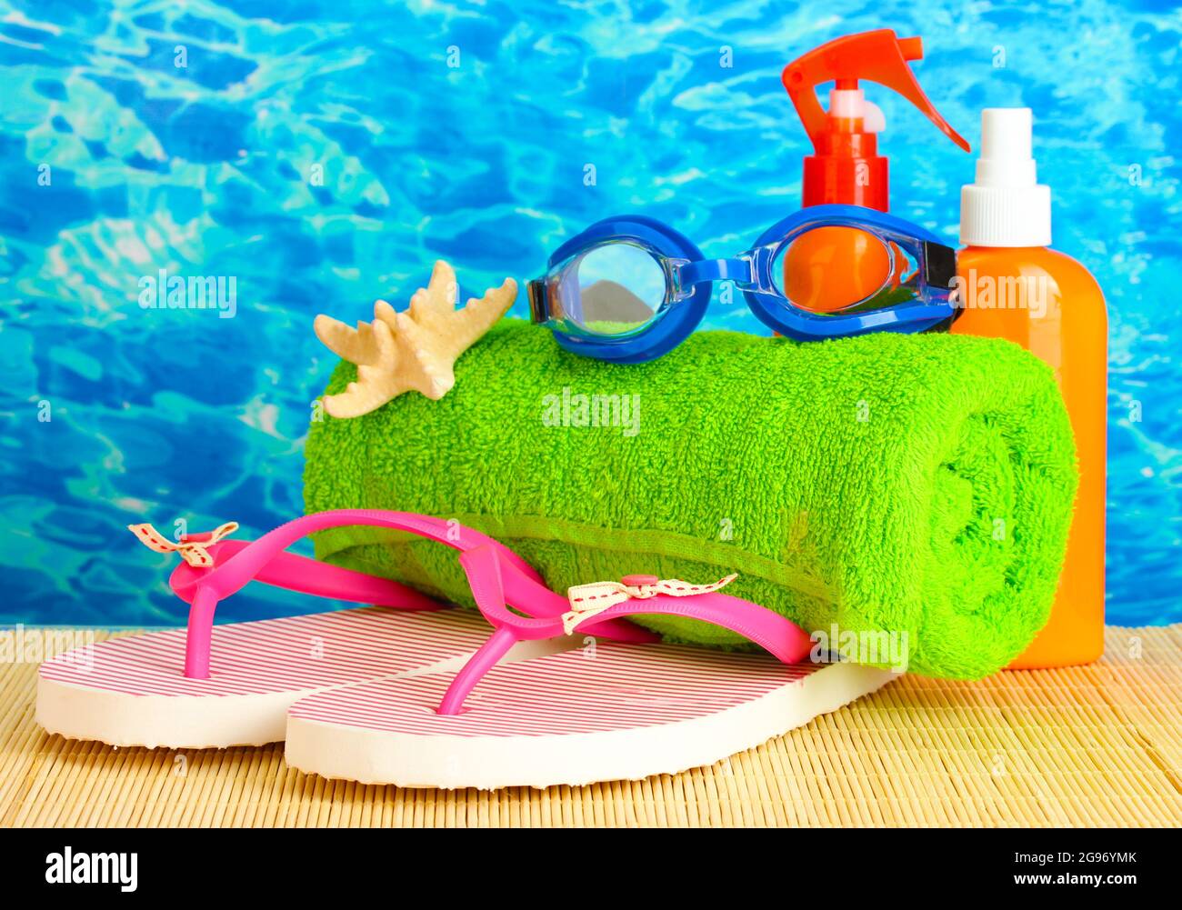 bright beach accessories, on blue sea background Stock Photo - Alamy