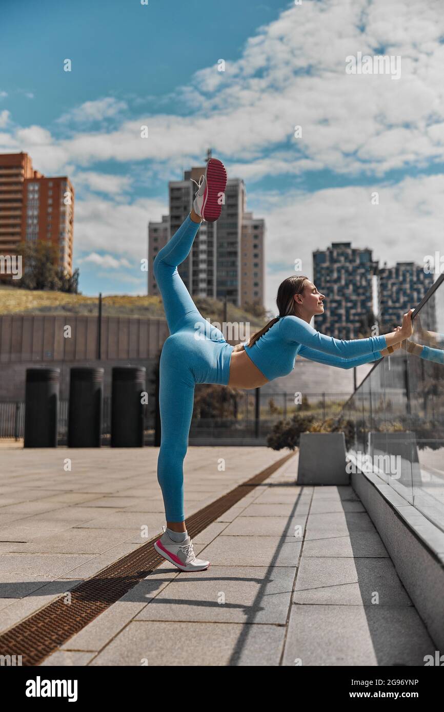 Beautiful fit young woman jogger is running outdoors Stock Photo - Alamy