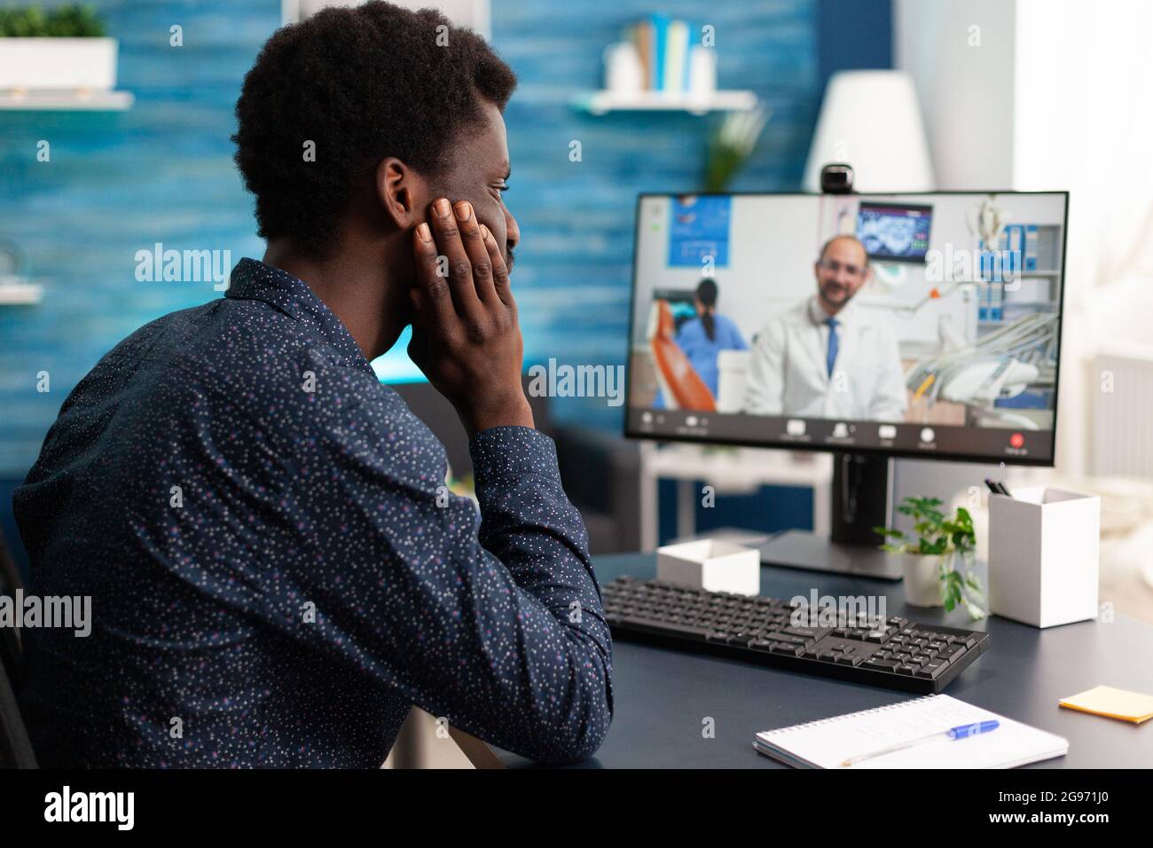 Healthcare consultation of african american guy talking to doctor using ...