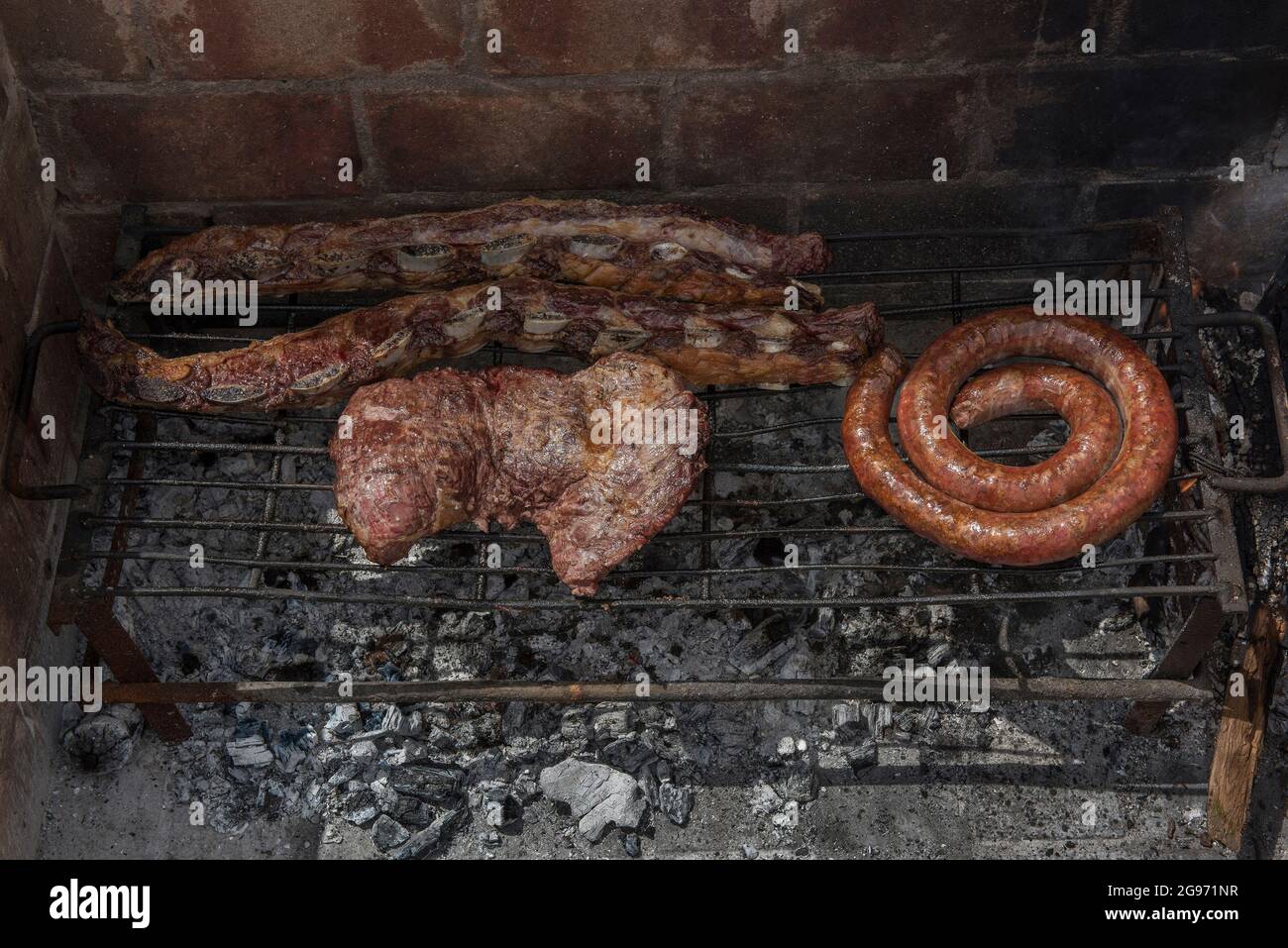 Grilled beef and pork sausages, traditional Argentine Asado, La Pampa ...