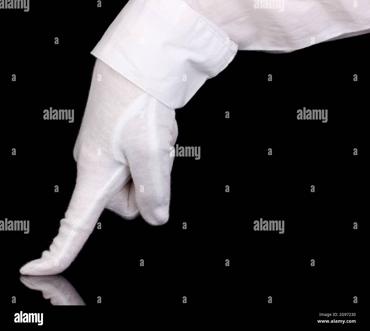 Female hand checking cleanliness isolated on black Stock Photo - Alamy