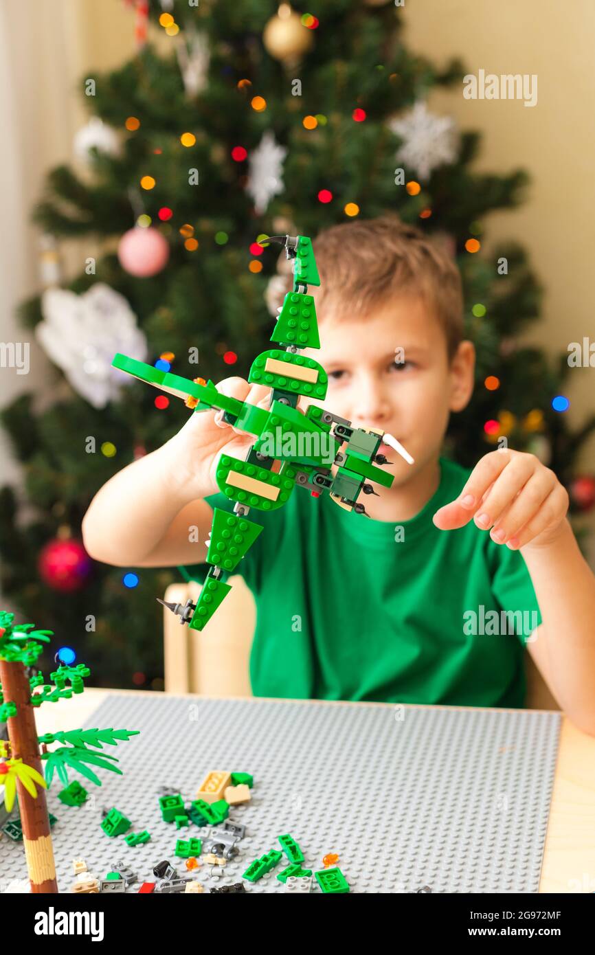 Saint-Petersburg, Russia - November 29, 2020 Cute boy collecting block ...