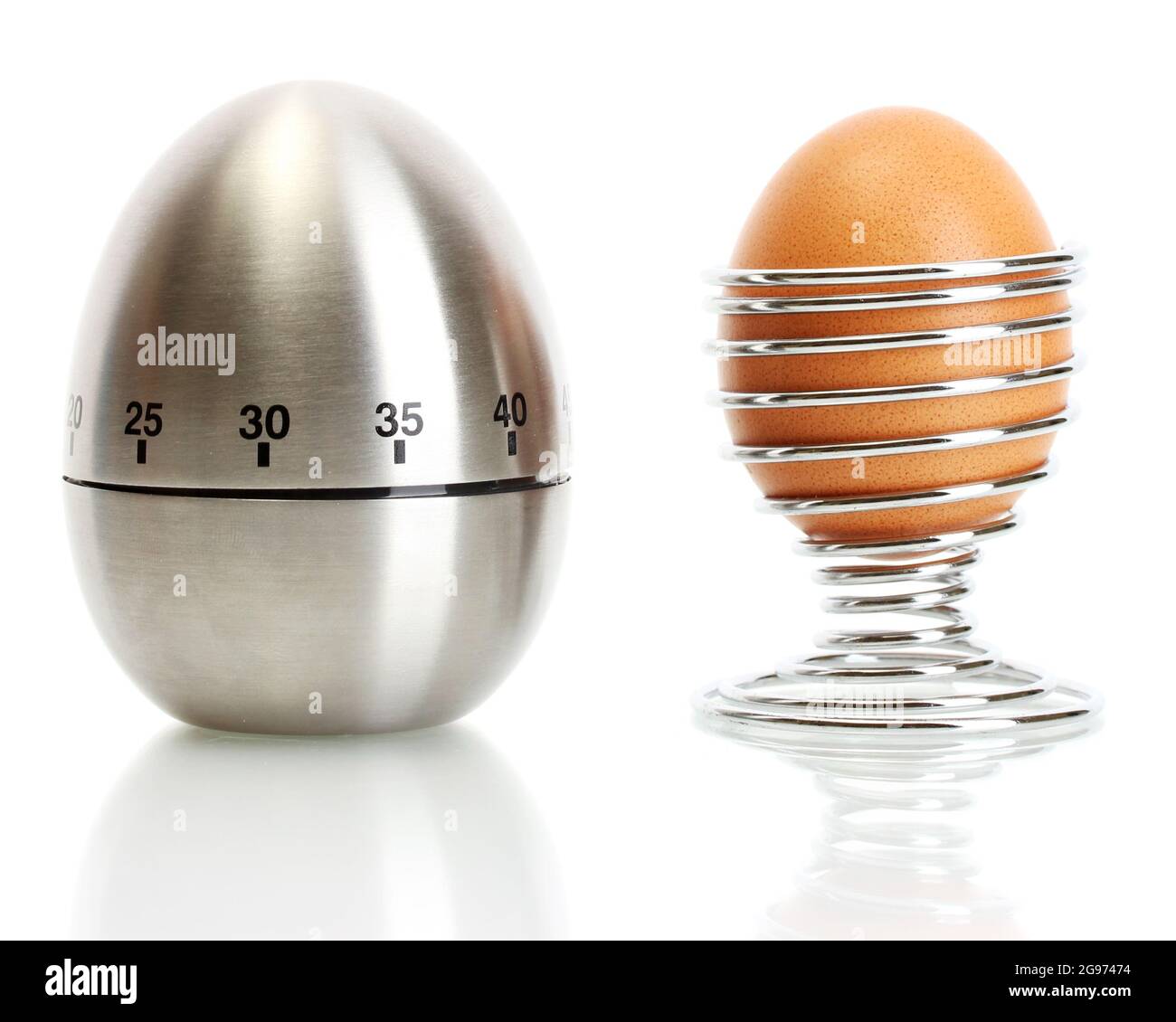 egg timer and egg in metal stand isolated on white Stock Photo - Alamy